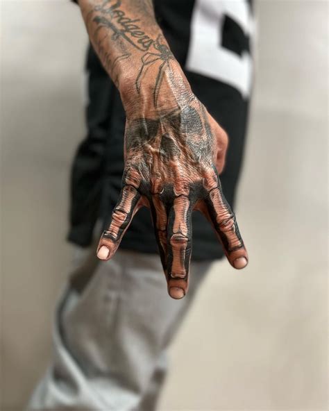 61 Skeleton Hand Tattoo Ideas And Meanings Hand Tattoos Skeleton