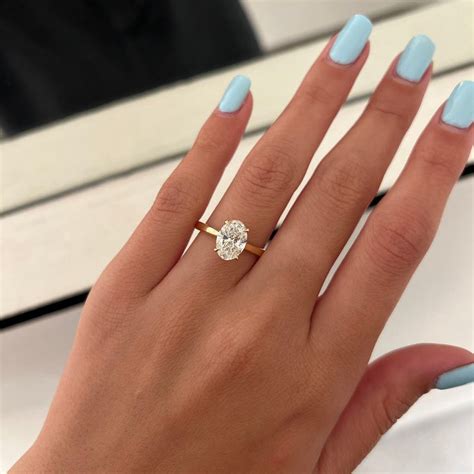 2 Ct Oval Lab Grown Diamond Hidden Halo Engagement Ring In Yellow Gold