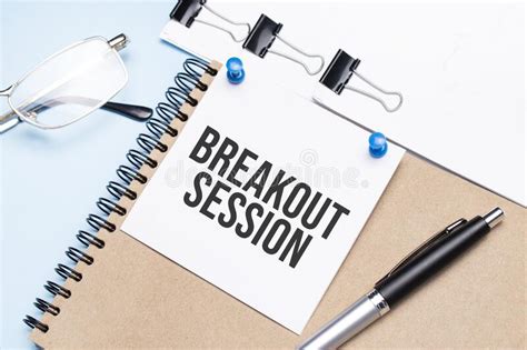 notepad with breakout session text on the office table with glasses
