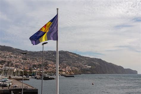 Funchal Flag Of Madeira Waving In The Wind At The Harbour Of Funchal