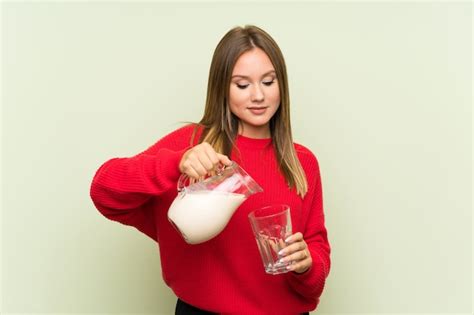 Premium Photo Teenager Girl Holding A Glass Of Milk