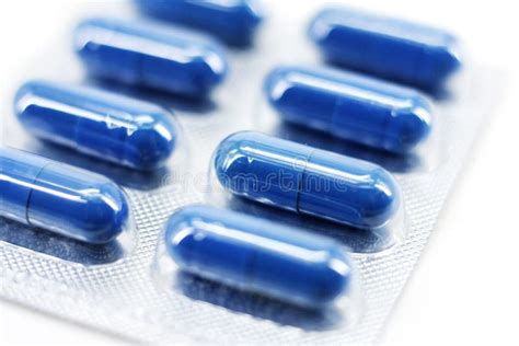 Two Blue Capsules Pills For Men`s Health And Sexual Energy On An