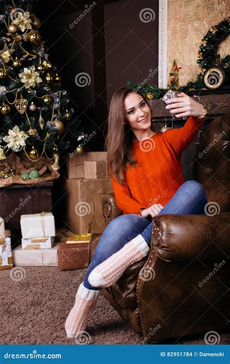 Cheerful Young Woman Taking A Christmas Selfie With Smartphone Stock