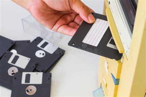 Hand Inserting A Inch Floppy Disk Into A Floppy Drive Slot O Stock Photo Image Of Connect