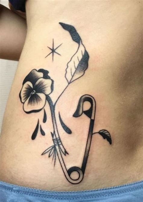 Exploring The Meaning Of A Safety Pin Tattoo A Guide To The Meaning Behind This Tattoo Design