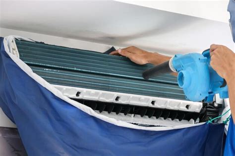 Premium Photo Air Conditioning Cleaning Service With Air Blower