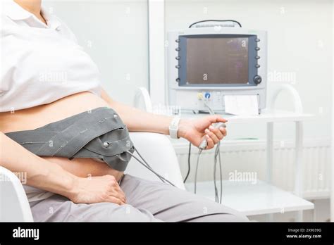 A Pregnant Woman Performing Cardiotocography Ctg To Monitor Fetal