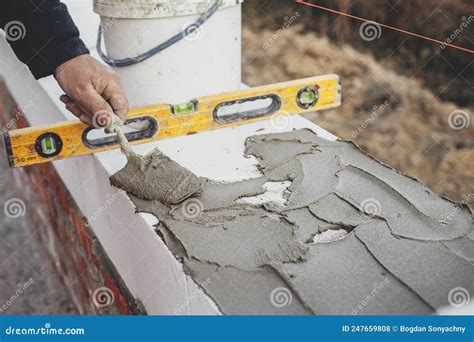 Worker Laying Autoclaved Aerated Concrete Blocks Working With Adhesive