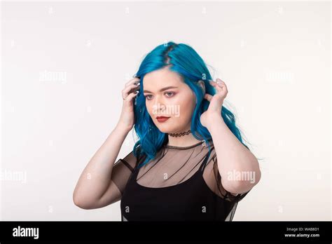 People And Fashion Concept Beautiful Woman With Blue Hair Posing Over