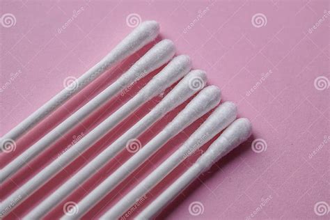Top View Of Cotton Swabs On A Pink Background Hygiene Concept Stock