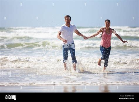 She Brings Out The Fun In Me Shot Of A Young Couple Being Playful On
