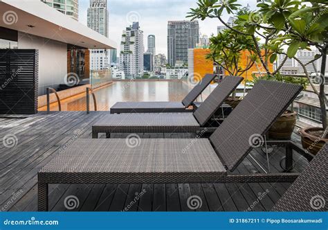 Sunbeds Beside The Swimming Pool In Resort Stock Image Cartoondealer
