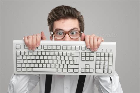 Nerd In Glasses With Keyboard In Studio Stock Photo By Kegfire PhotoDune