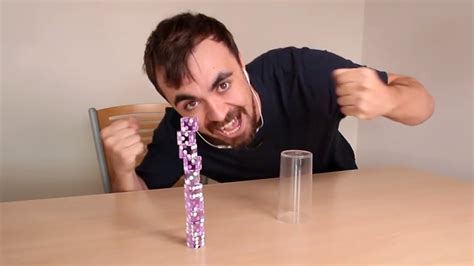 Determined Man Quickly Learns How To Stack Dice With A Cup