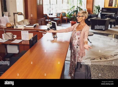 Mature Woman Comes To The Hotel At The Reception She Is Tired Of