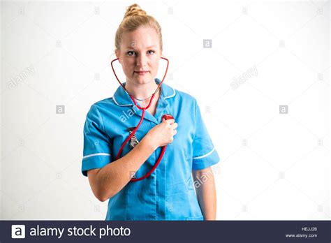 UK Health Care Professionals A National Health Service NHS Woman Female Nurse Listening To