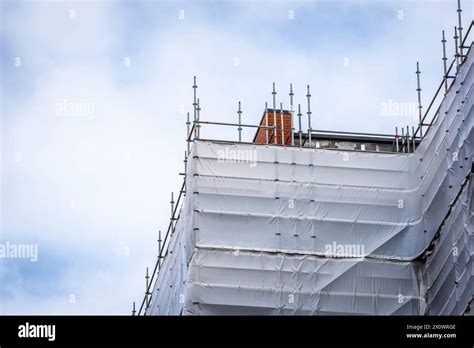 Flame Retardant Scaffold Sheeting Wrapped Apartments Building During Insulation In England Uk