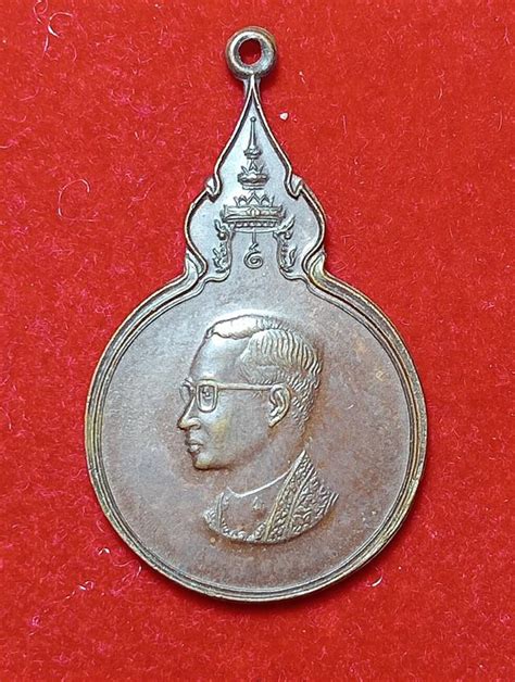 เหรียญงานปฏิบัติธรรมเฉลิมพระเกียรติ ร 9 เฉลิมพระชนพรรษา 5 รอบ ปี 2530 เนื้อทองแดง Ennxo