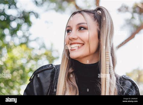 A Stunning Young Woman With Blonde And Braided Hair Is Captured
