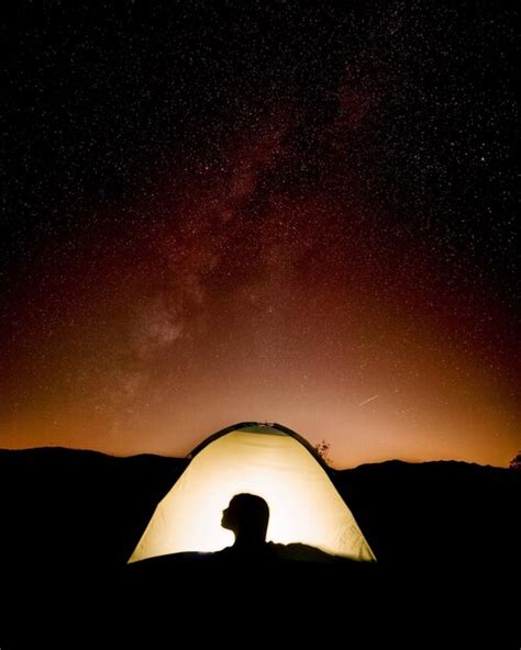 Premium Photo Shadow Of Person In Illuminated Tent Against Star Field