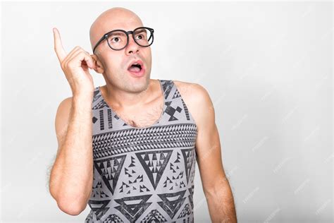 Premium Photo Portrait Of Bald Nerd Man With Eyeglasses Pointing Up