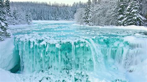 Stunning Winter Wonderland With Majestic Icy Waterfall In Snowy Forest
