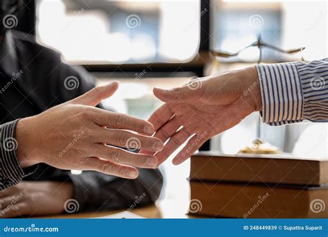 Lawyers Shake Hands With Clients Who Come To Testify In The Case Of