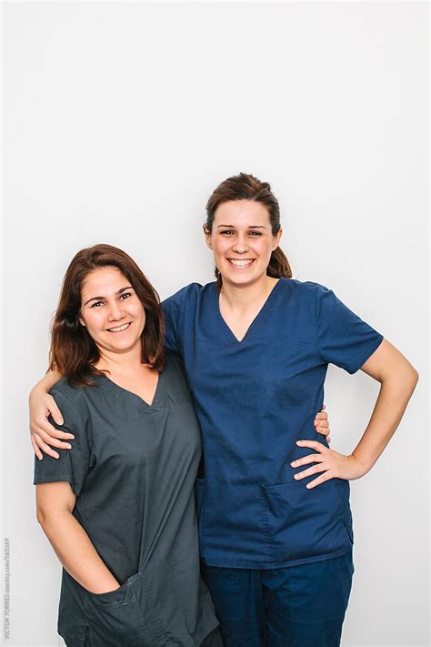 Two Biologists Over White Background By Stocksy Contributor Victor