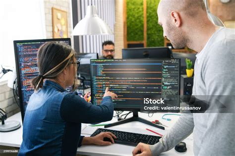 Software Programmers Analyzing Html Code And Database Brainstorming
