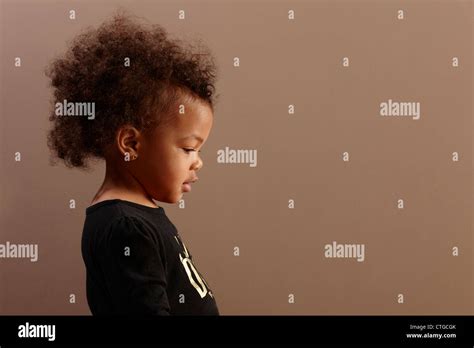Serious Mixed Race Baby Girl Stock Photo Alamy