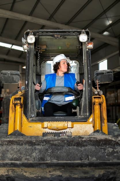 Free Photo Professional Female Driver Operating Forklift Vehicle