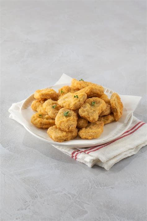 Delicious Golden Chicken Nuggets On A Plate On The Table Fast Food