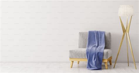 회색 벨루어 안락의자 파란색 격자 무늬 흰색 벽 3d 렌더링 위에 나무 플로어 램프가 있는 거실 내부 사진 Unsplash의 가구 이미지