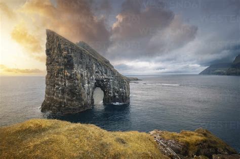 Sunset At Drangarnir The Famous Sea Stack In Vagar Island Faroe