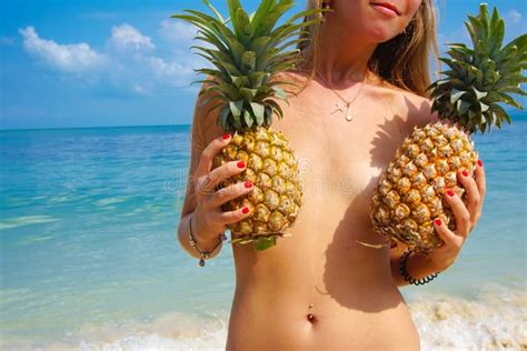 Close Up Of Girl With Pineapples With Tropical Sea At Background Beach
