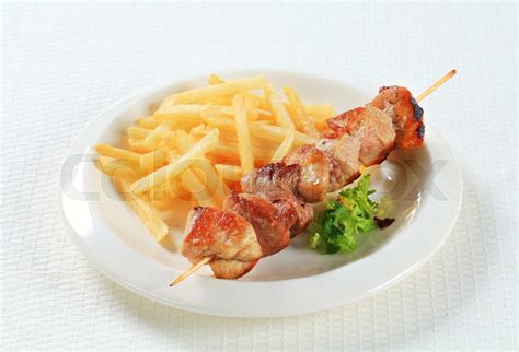 Pork Skewer With French Fries Stock Image Colourbox