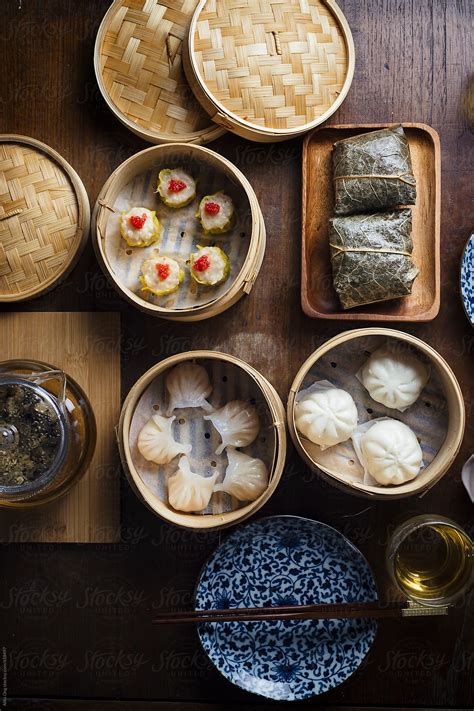 Assorted Dim Sum On Wooden Table Del Colaborador De Stocksy Alita