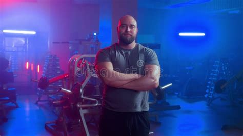 Portrait Of Bodybuilder Is Looking Confidently Straight At The Camera