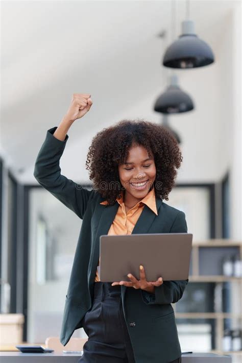Beautiful American African Business Women With Hands Up In Winner