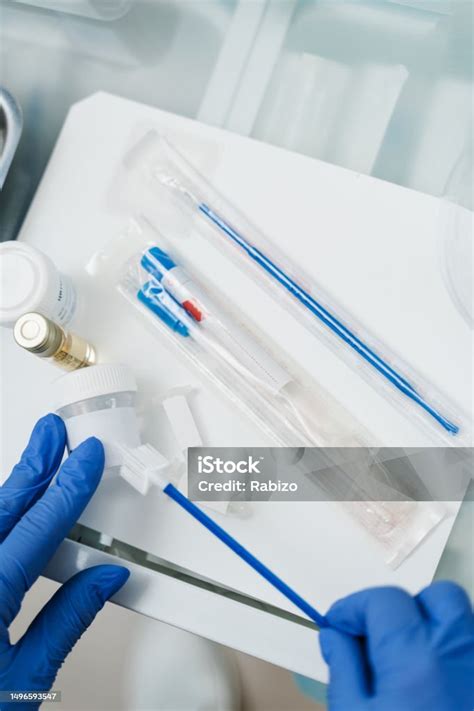 Gynecologist Is Holding Flask For Cytology Pap Smear Test In Hands