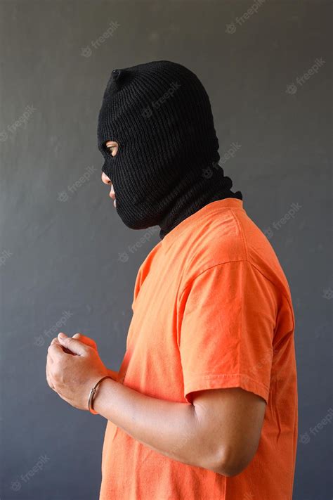 Premium Photo Side View Of A Prisoner In Orange Tshirt Wearing