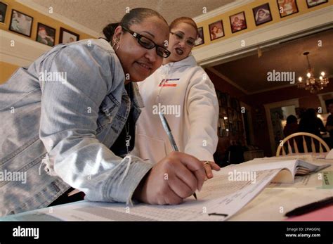 Tekeisha Tillis Left Signs In To Vote As Lisa Carmona Provides Assistance At A Polling Site