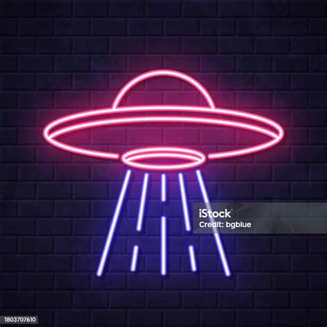 Ufo Flying Saucer With Light Beam Glowing Neon Icon On Brick Wall