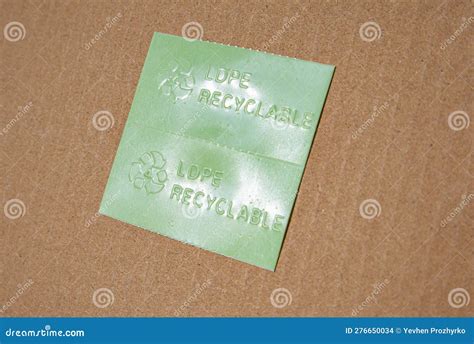 Sticker With 4 Ldpe Plastic Recycling Logo On The Cardboard Packaging