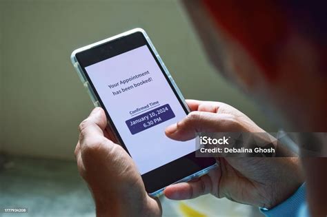 A South Asian Man Checking Smartphone Notification For His Upcoming