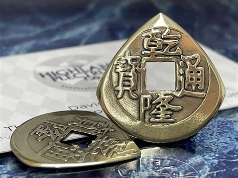 The Highland Plectrum Co One Brass Feng Shui Coin Plectrum Reverb