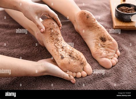 Young Woman Undergoing Treatment With Body Scrub In Spa Salon Stock