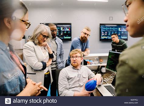 Computer Programmers Discussing Hi Res Stock Photography And Images Alamy