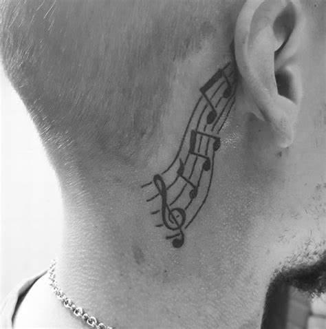 Get Inked The Secret Behind Music Note Face Tattoos Revealed See