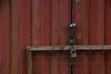 Premium Photo Close Up Of Padlock Hanging On Gate